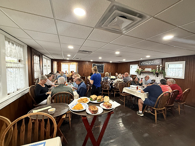 A dining room filled with happy patrons enjoying the fruits of The Blue Owl's labor. Notice how nobody's looking at their phones—the food demands full attention.