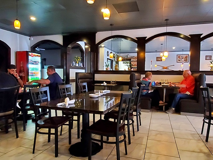 Happy diners lost in conversation and good food. The universal language of "mmm" transcends all cultural barriers in this welcoming space.