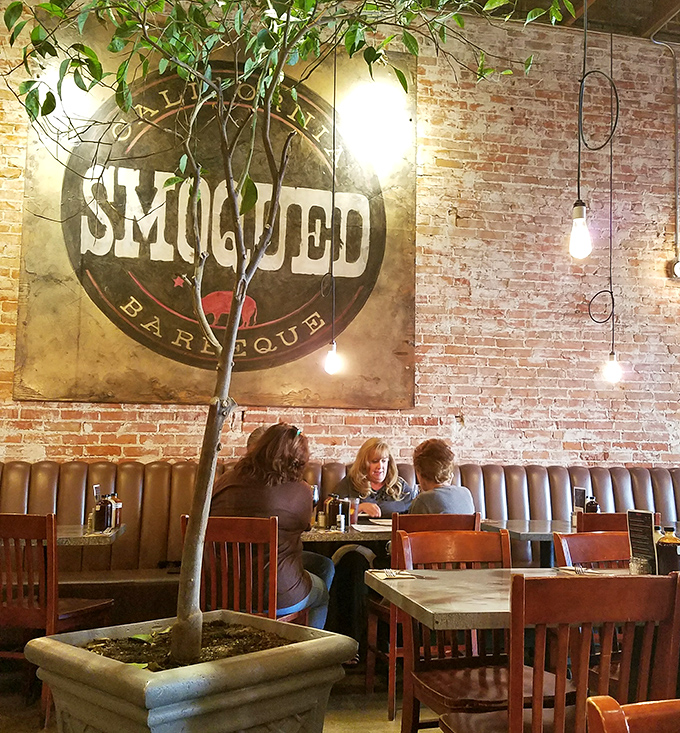Every great meal creates memories. Under that vintage Smoqued sign, conversations flow as freely as the sauce.