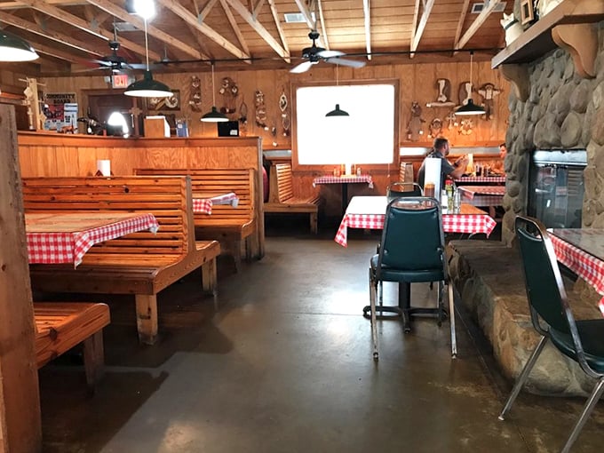 Wooden booths with red-checkered tablecloths &ndash; the universal signal that you're about to eat something honest, unpretentious, and deeply satisfying.