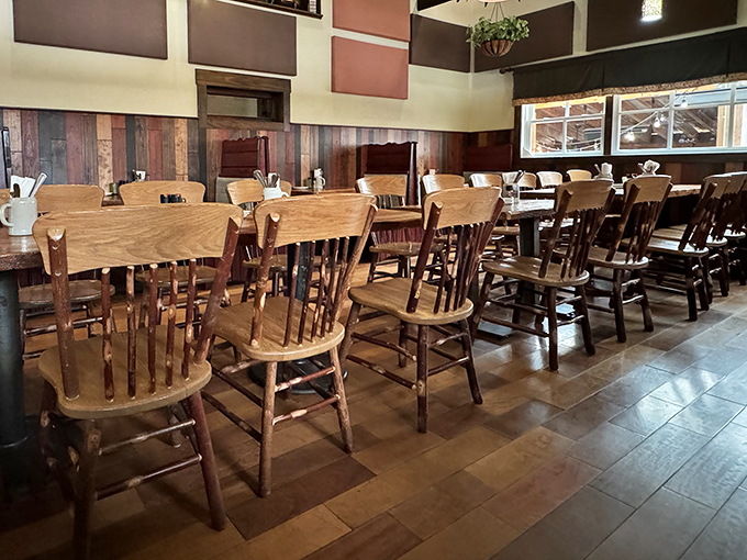 The dining room waits expectantly for the dinner rush, like a theater before the show. Those wooden chairs have supported countless happy diners.
