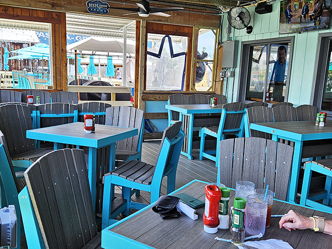 Turquoise tables on the deck create the perfect Florida frame for your seafood masterpiece and afternoon cocktail.