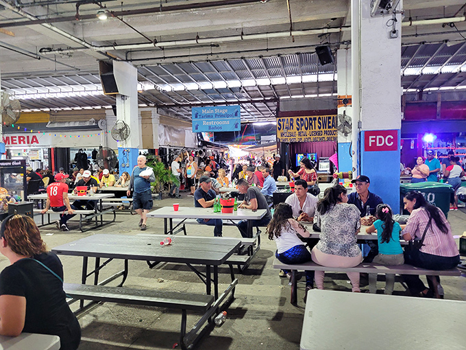 The food court buzzes with hungry shoppers refueling for round two. These communal tables have heard more bargaining stories than a car dealership break room.