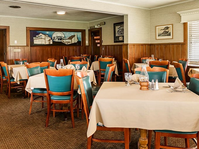 Cream linens and turquoise chairs create a color palette that's been welcoming diners through decades of celebrations.
