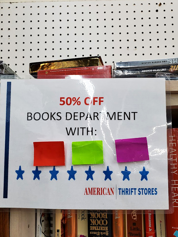 Bookworms rejoice! The 50% off sign means your reading habit just got more affordable. Color-coded stickers create a treasure map to literary bargains.