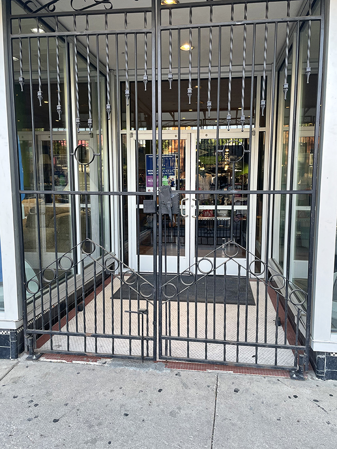 The ornate iron gates guard the entrance to this wonderland of secondhand treasures like sentinels protecting a retail kingdom.