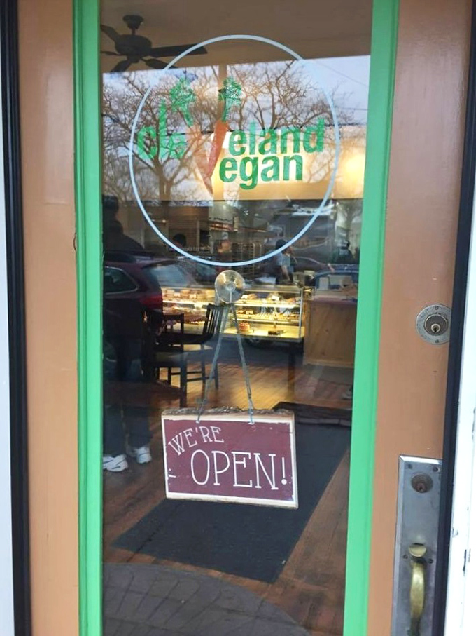 The welcoming green-trimmed door feels like the entrance to a secret society where plants get the respect they deserve.