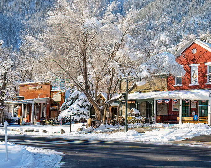 Winter transforms Genoa into a snow globe scene, the red brick buildings standing warm and inviting against nature's frosty embrace.