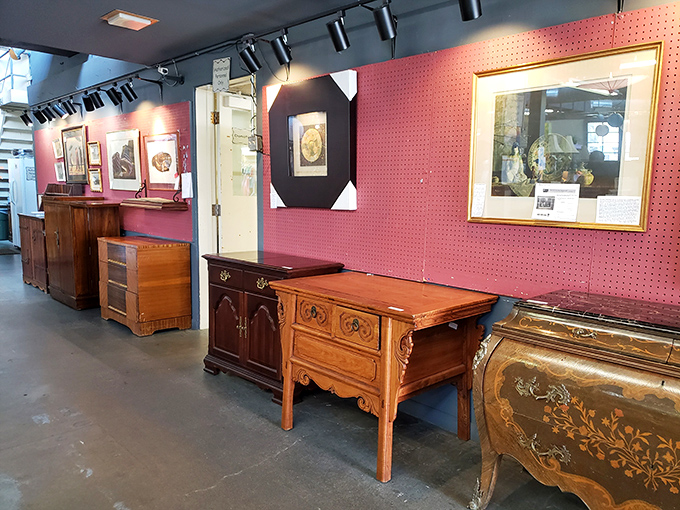 A gallery of wooden craftsmanship against a pop of pink&mdash;these aren't just dressers and cabinets, they're heirlooms-in-waiting.