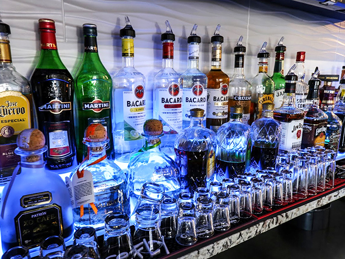 A bartender's rainbow of spirits stands ready for crafting the perfect accompaniment to your seafood feast. From martinis to margaritas, there's a libation for every palate.