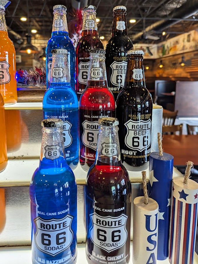 Route 66 sodas in colors not found in nature—electric blue and cherry red—offering a sweet, nostalgic sip of Americana between bites.
