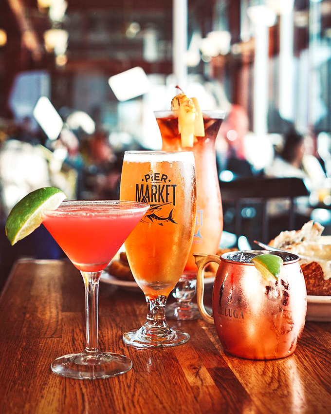 Cocktail hour at Pier Market means vibrant concoctions in equally photogenic glassware—liquid souvenirs that vanish too quickly.