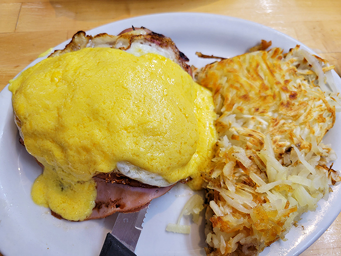 Eggs Benedict with hollandaise that could make a grown adult weep with joy. Those hash browns deserve their own fan club.