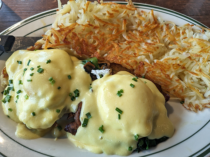 Eggs Benedict with crispy hash browns that could make a potato farmer weep with pride. Hollandaise sauce applied with generous abandon.