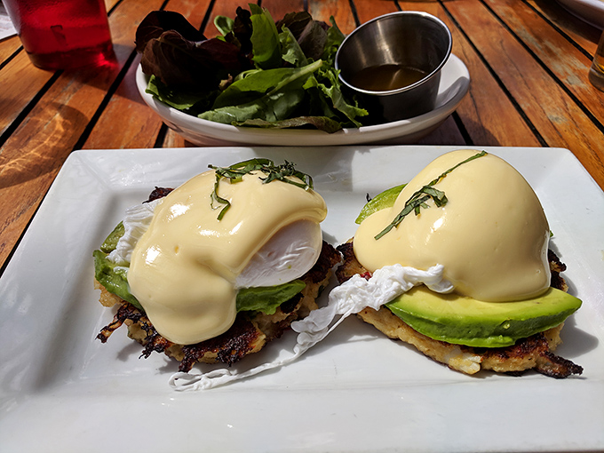 Eggs Benedict gets a coastal makeover with perfectly poached eggs and avocado&mdash;breakfast that makes you want to high-five the chef.