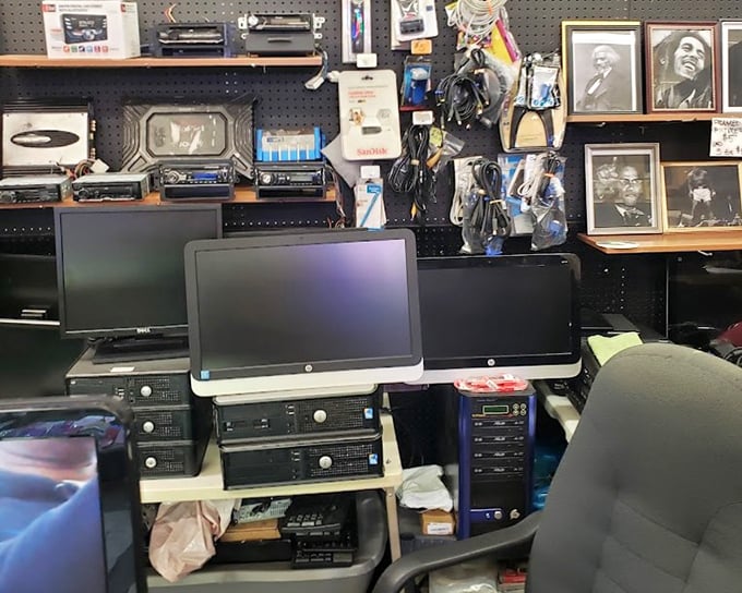 The electronics corner, where vintage tech meets framed musical legends. That Dell desktop might not run Windows 11, but it's perfect for the digital minimalist.