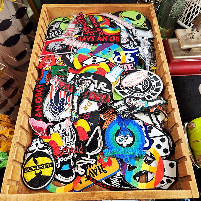 A wooden box bursting with colorful patches&mdash;tiny fabric time machines ready to transform your denim jacket into a personal statement.