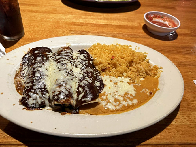These enchiladas aren't just covered in sauce and cheese&mdash;they're tucked in with a blanket of flavor for a siesta on your plate.