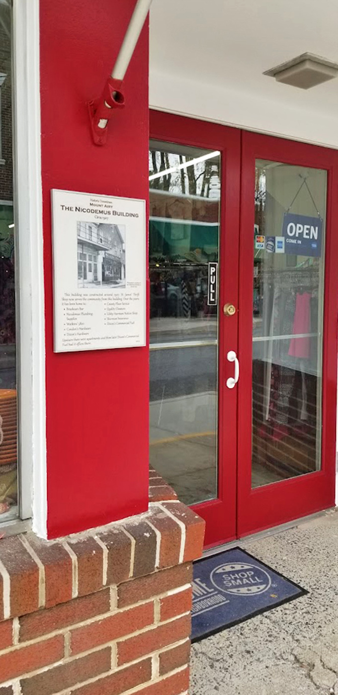 The red doors of opportunity—step through to discover the historic Nicodemus Building's second life as a bargain hunter's paradise.