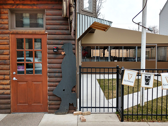 That wooden door might as well be a portal to pizza paradise. The silhouette cutout stands guard like a sentinel of good taste.