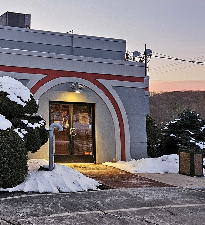 Winter's chill makes the warm glow behind these doors even more inviting&mdash;a snow-framed entrance to comfort food paradise.