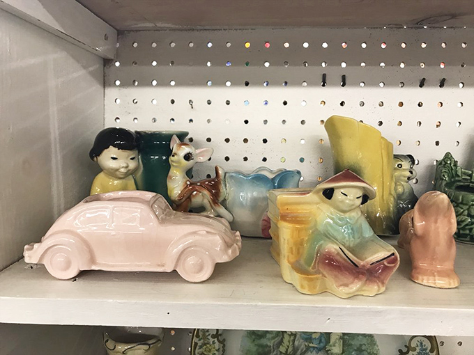 Ceramic figurines pose like tiny actors in life's sweetest, most whimsical and endearing little stage play.