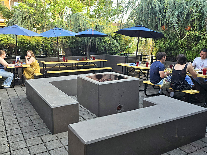 The concrete fire pit doesn't just warm hands&mdash;it extends Portland's precious outdoor dining season well into the months when umbrellas usually hibernate.