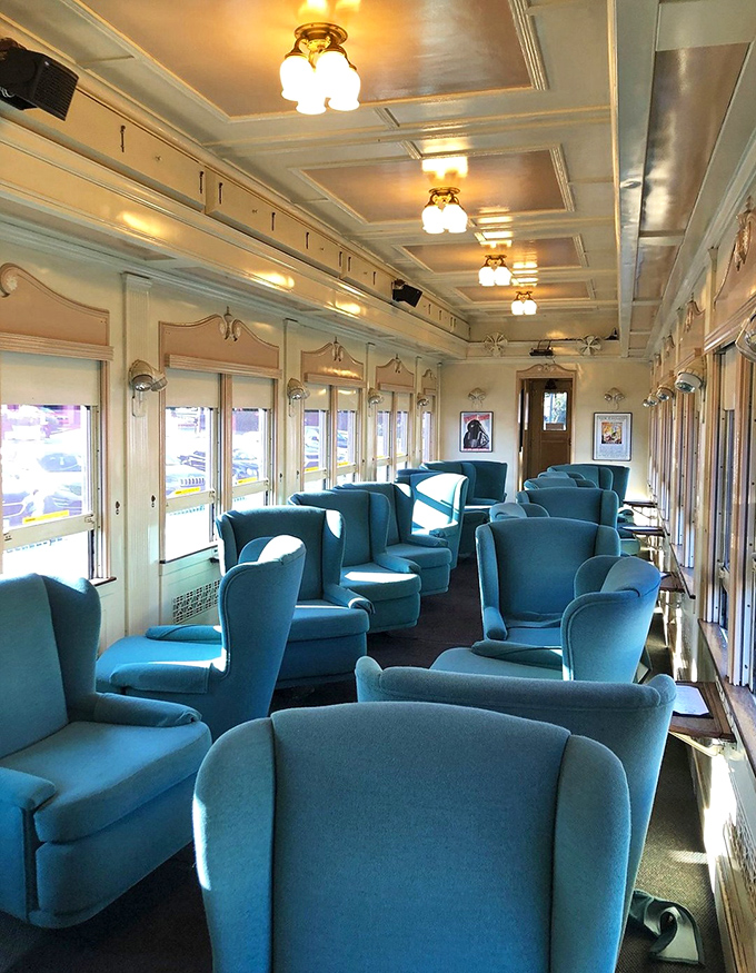 First-class seating in turquoise velvet proves that vintage transportation cared deeply about passenger comfort and style.