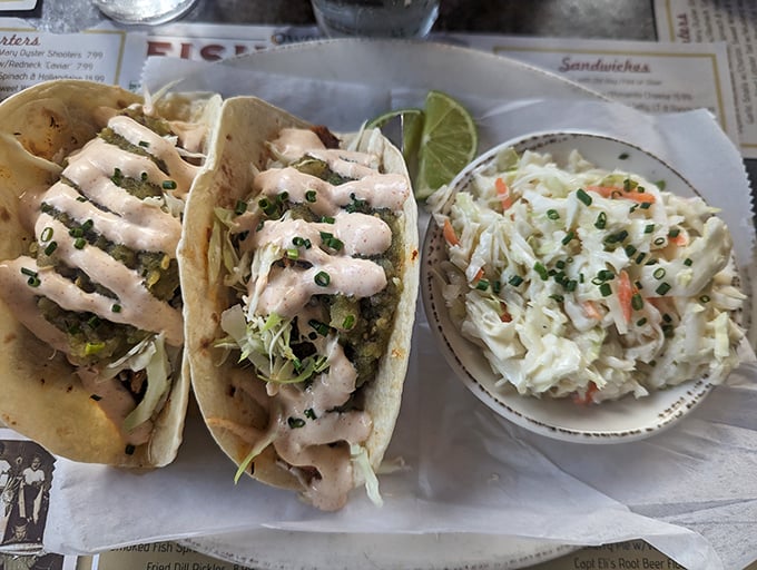 Fish tacos that tell a story with every bite &ndash; the sauce drizzled on top is writing poetry about the sea.
