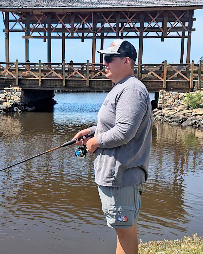 The age-old equation: one fisherman plus one bridge equals hours of contentment. Some traditions never need updating.