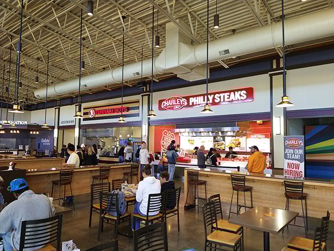 Tommy Hilfiger's vibrant orange storefront stands out like a fashion beacon in the retail wilderness. Even from a distance, it screams "your wallet is about to get lighter."