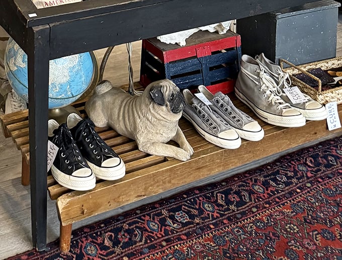 Even the footwear section gets the gallery treatment, with vintage sneakers sharing space with a whimsical pug statue.