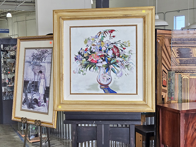 Framed artwork stacked gallery-style, where masterpieces and family portraits mingle like guests at an eclectic dinner party.