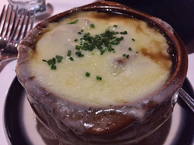 The legendary French onion soup in its natural habitat &ndash; a ceramic crock of bubbling, cheesy perfection that's worth every calorie.
