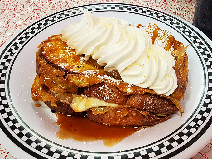 This French toast isn't just breakfast&mdash;it's dessert in disguise, crowned with a cloud of whipped cream and maple syrup rivers.