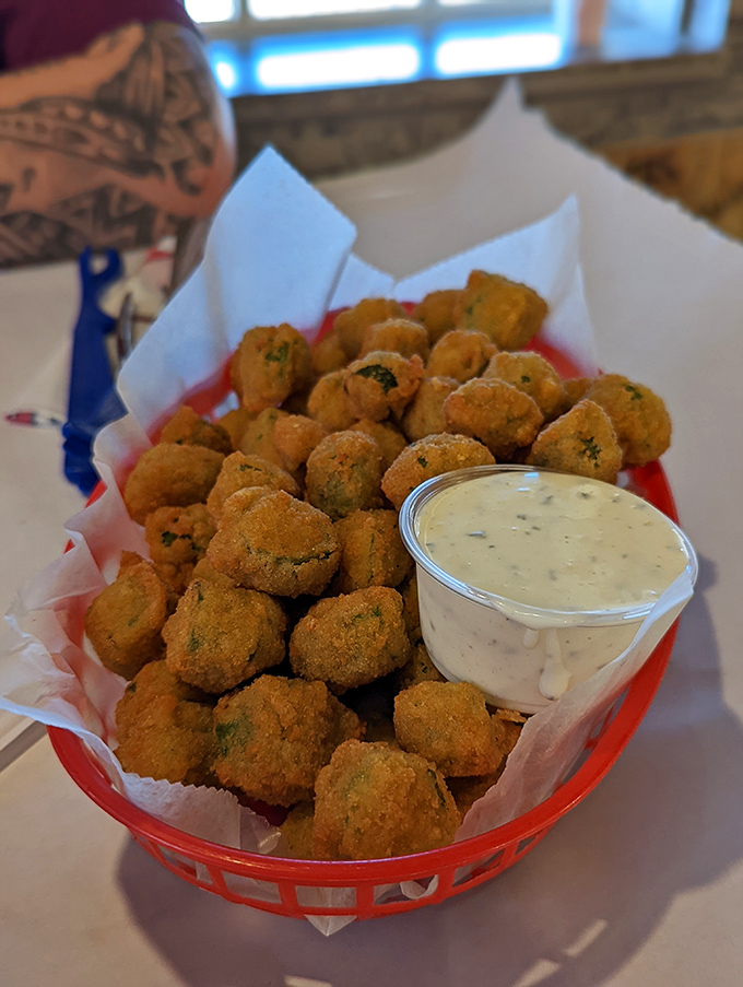 Fried okra that could convert even the most stubborn skeptics&mdash;crispy, seasoned bites served with a creamy dip for dunking delight.