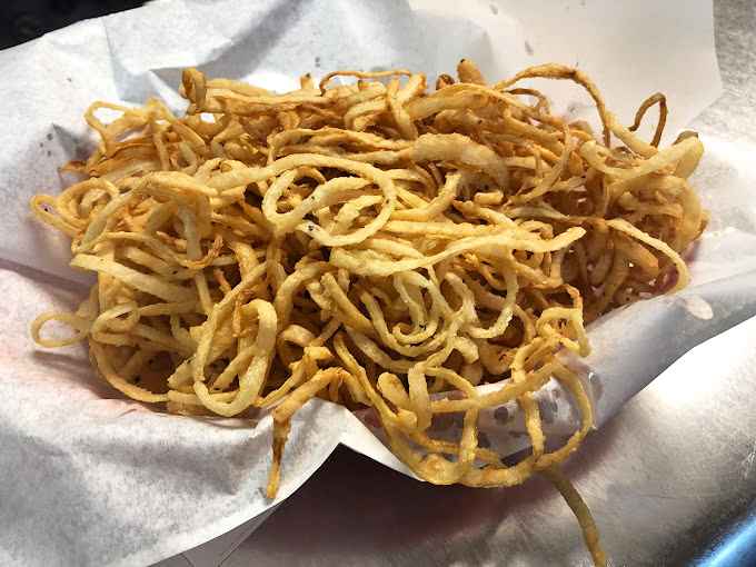 These aren't just onion straws&mdash;they're a crispy, golden tangle of happiness that somehow makes everything they touch taste better. Worth every calorie.