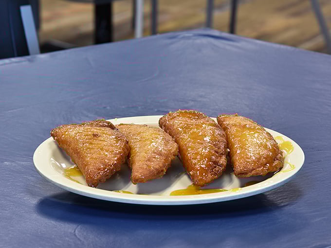 These fried pies emerge golden and glistening, ready to complete your meal with portable, hand-held sweetness that's pure genius.