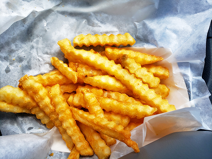 These aren't just crinkle-cut fries; they're golden wands that transform hangry into happy with magical efficiency.