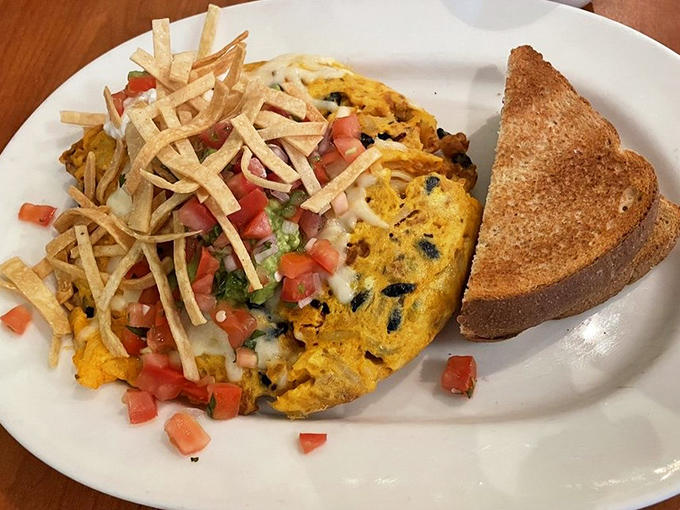 This frittata ranchero wears its southwestern influences proudly, with crispy tortilla strips standing at attention like they're guarding breakfast gold.