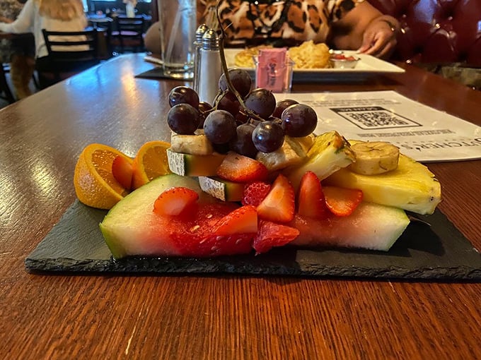 A fruit plate that doesn't apologize for being healthy. Fresh strawberries, melon, and grapes arranged with the care usually reserved for diamond displays at Tiffany's.