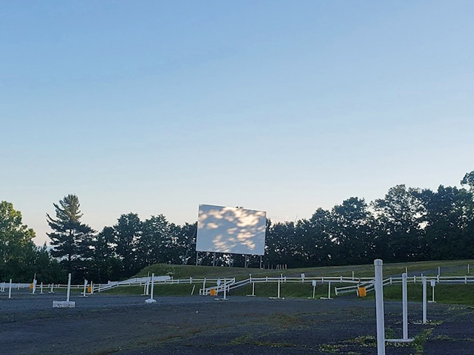Morning light reveals the quiet dignity of the screen, standing sentinel over empty spaces that will fill with laughter and wonder by nightfall.