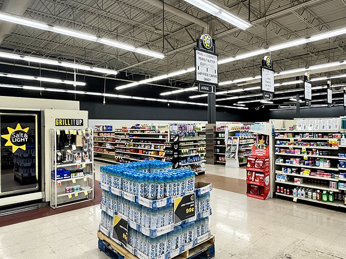 Grocery aisles stocked with essentials transform this thrift store into a comprehensive community hub serving multiple needs under one roof.