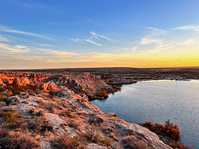 Sunset transforms the landscape into nature's light show. The red rocks blush even deeper, as if flattered by your attention.