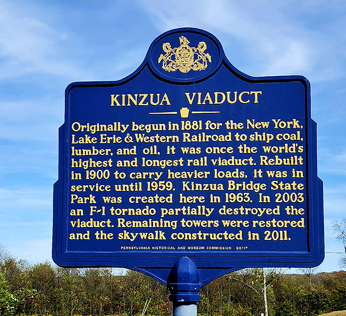 History cast in blue and gold. This marker tells the tale of engineering triumph, devastating loss, and remarkable reinvention.