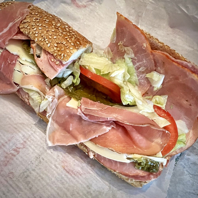 This isn't just a sandwich&mdash;it's architectural genius. Layers of Italian meats, cheese, and veggies on a sesame-studded roll that deserves its own zip code.