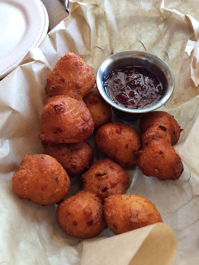 These hush puppies aren't just fried cornmeal&mdash;they're golden orbs of Southern tradition that demand to be dunked in that sweet dipping sauce.