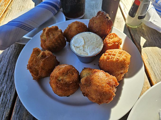 These aren't just hushpuppies&mdash;they're golden orbs of cornmeal joy that make you wonder why anyone bothers with regular bread.