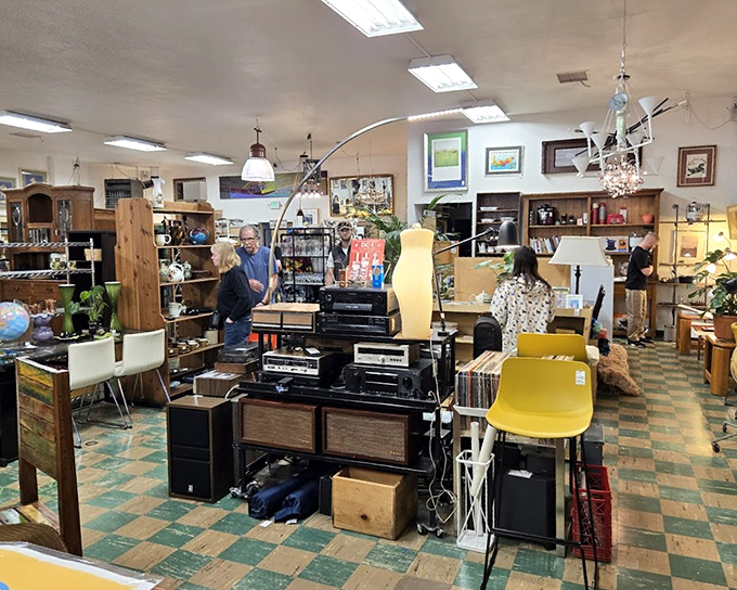 The electronics corner: where vintage stereo equipment and mid-century furniture create a time capsule that would make Don Draper feel right at home.
