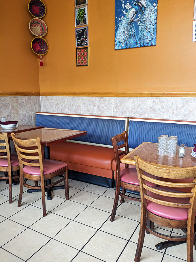 Cozy booths and simple tables create the perfect backdrop for the real stars of the show: the vibrant, complex dishes that arrive steaming hot.